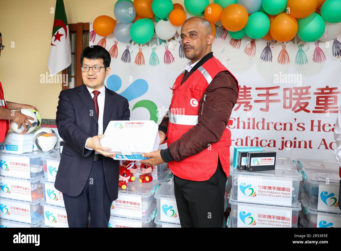 Algiers. 31st May, 2023. Chinese Ambassador to Algeria Li Jian (L) hands over the donation to ...