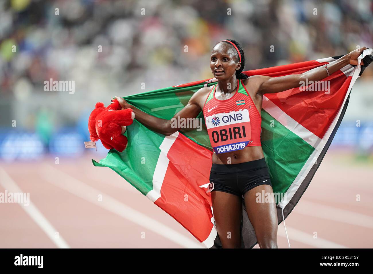 Hellen Obiri celebrating with her country's flag in the 5000 meters at ...