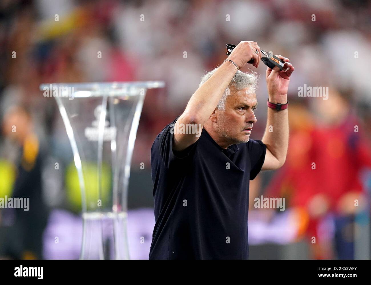Roma manager Jose Mourinho removes his runner up medal after losing the ...