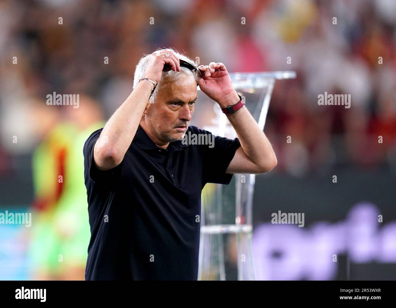 Roma manager Jose Mourinho removes his runner up medal after losing the ...