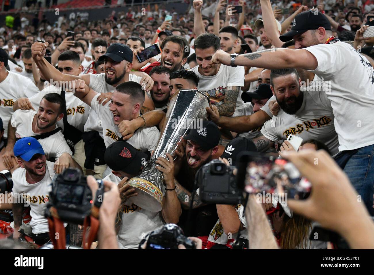 Sevilla's supporters celebrate with the trophy after their team won the ...