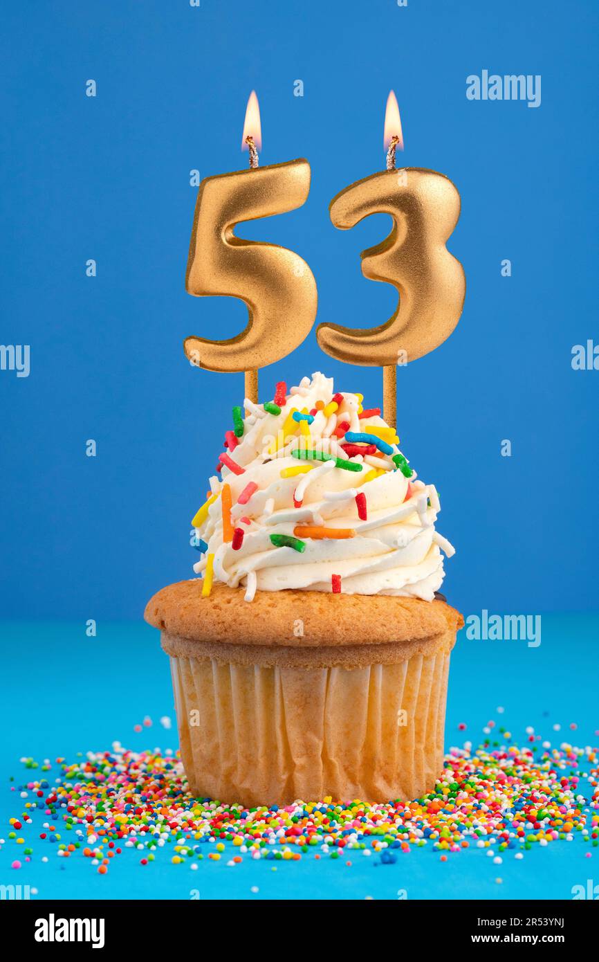 Candle number 53 - Cake birthday in blue background Stock Photo - Alamy