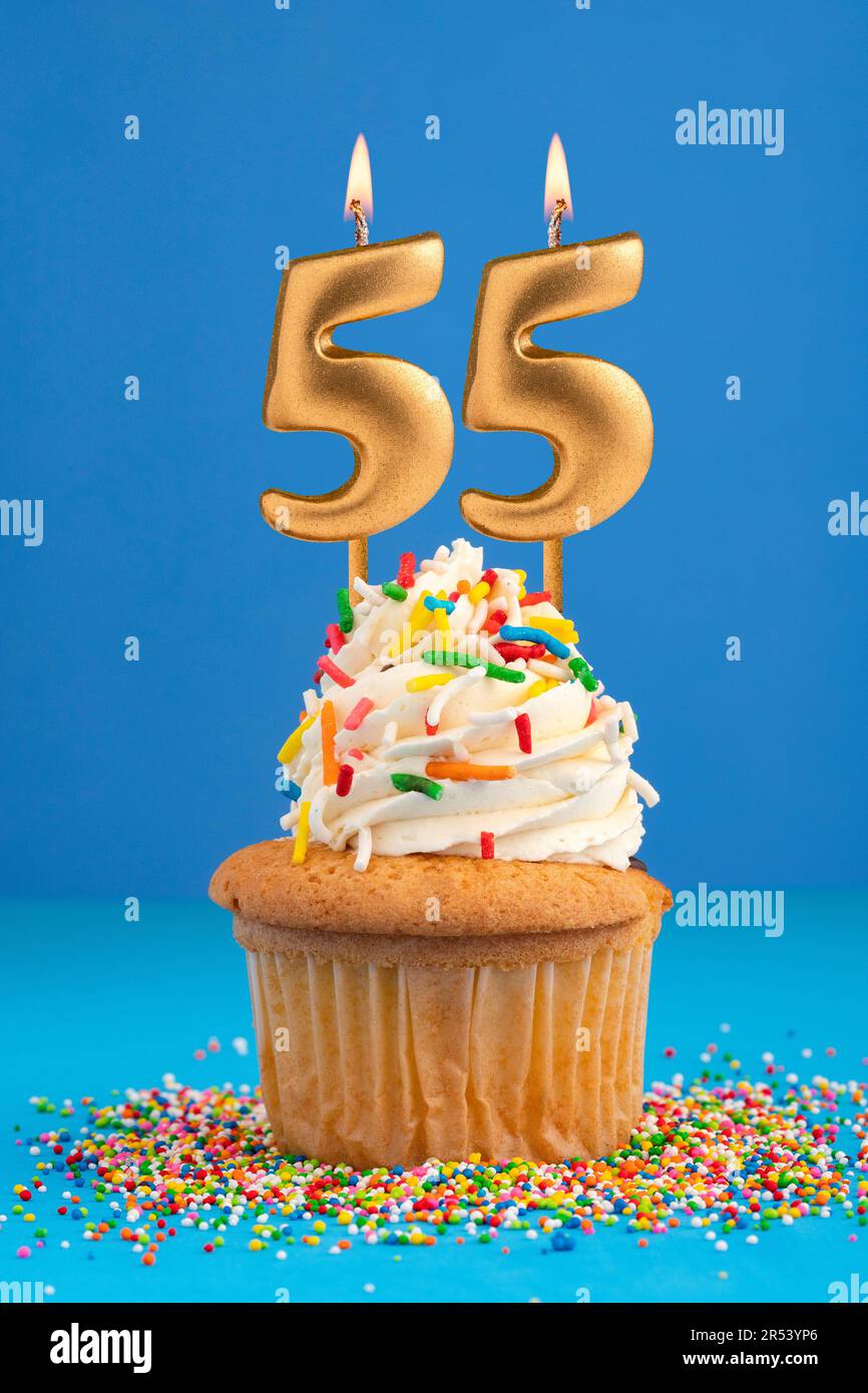 Candle number 55 - Cake birthday in blue background Stock Photo - Alamy