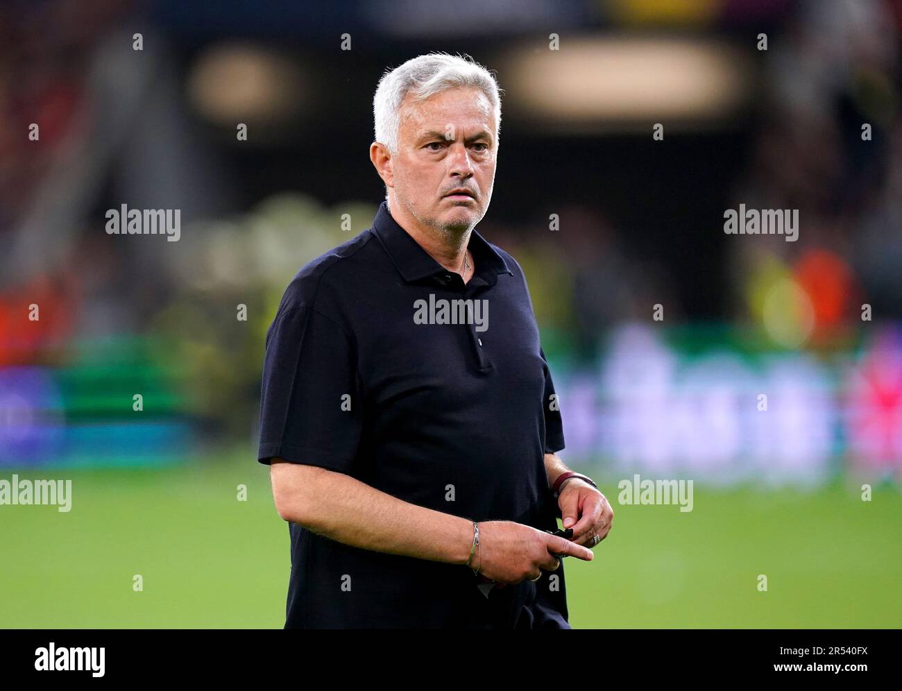 Roma manager Jose Mourinho walks off after being presented with his ...