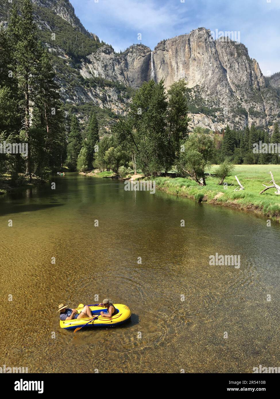 A group of people enjoy a relaxing summer vacation day floating in ...