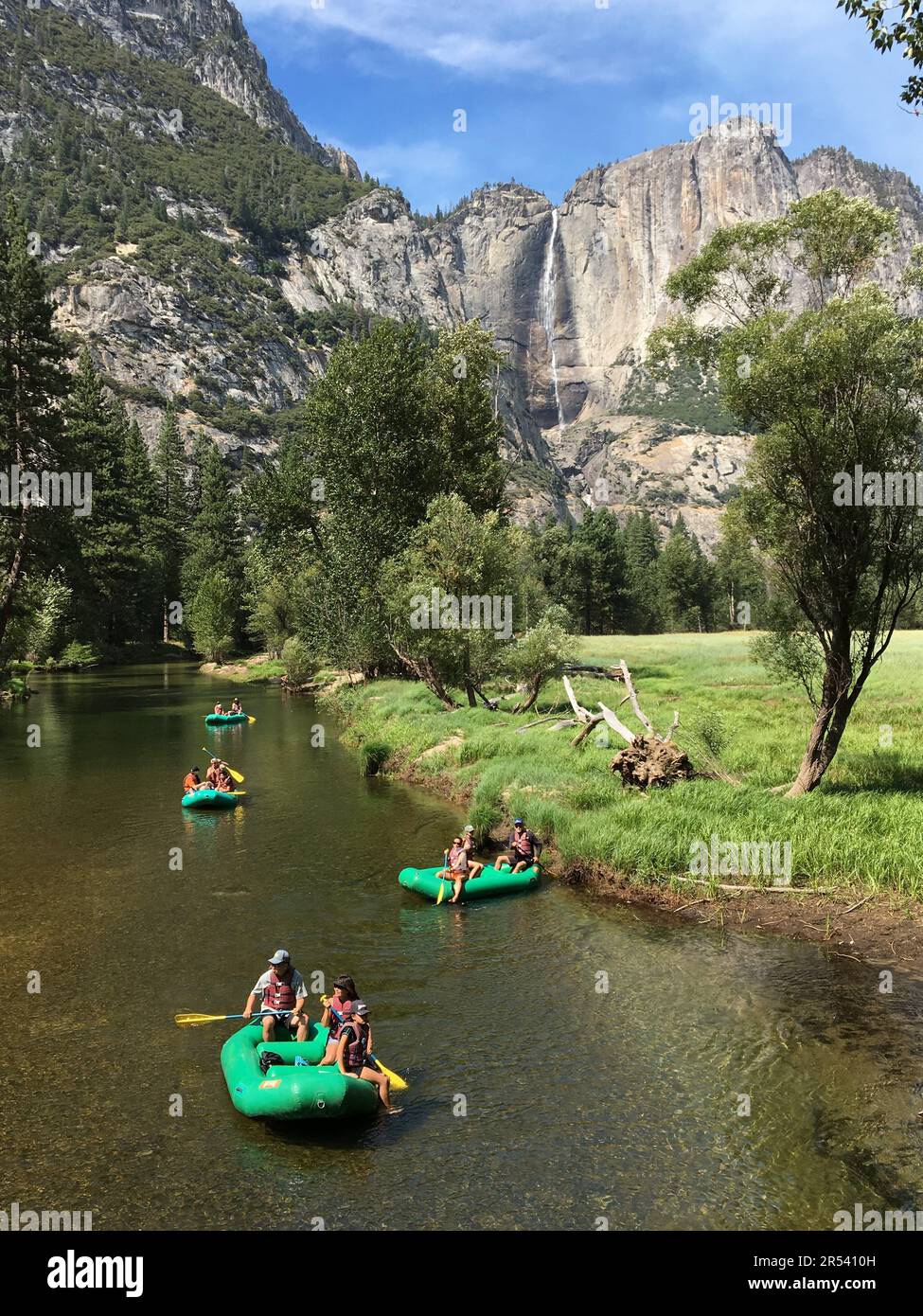 People and families enjoy a summer vacation day rafting down the Merced ...