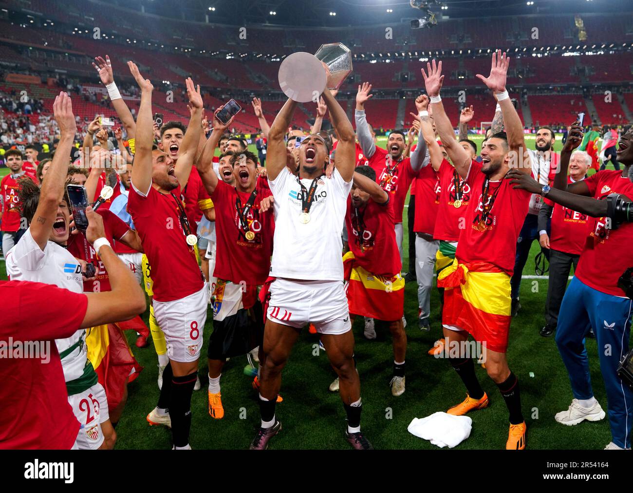 Sevilla's Loic Bade lifts the UEFA Europa League trophy as he ...