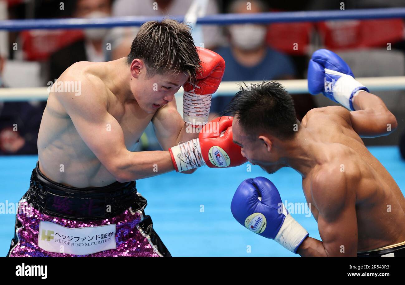 Hayato Tsutsumi of Japan (L) punches Joe Santisima of Philippines ...