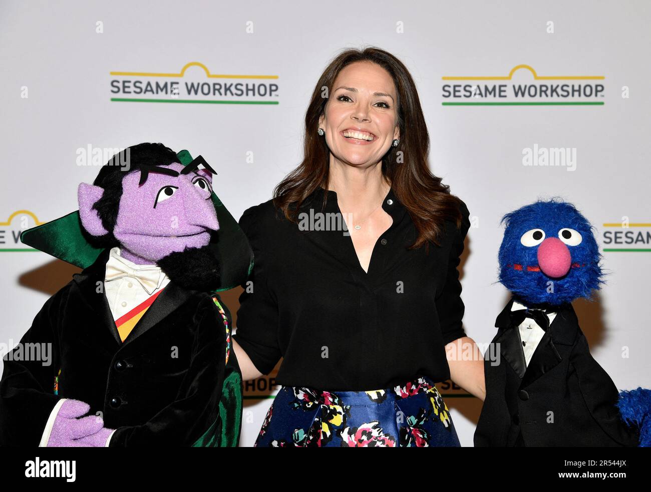 CNN anchor Erica Hill, center, poses with Count von Count, left, and ...