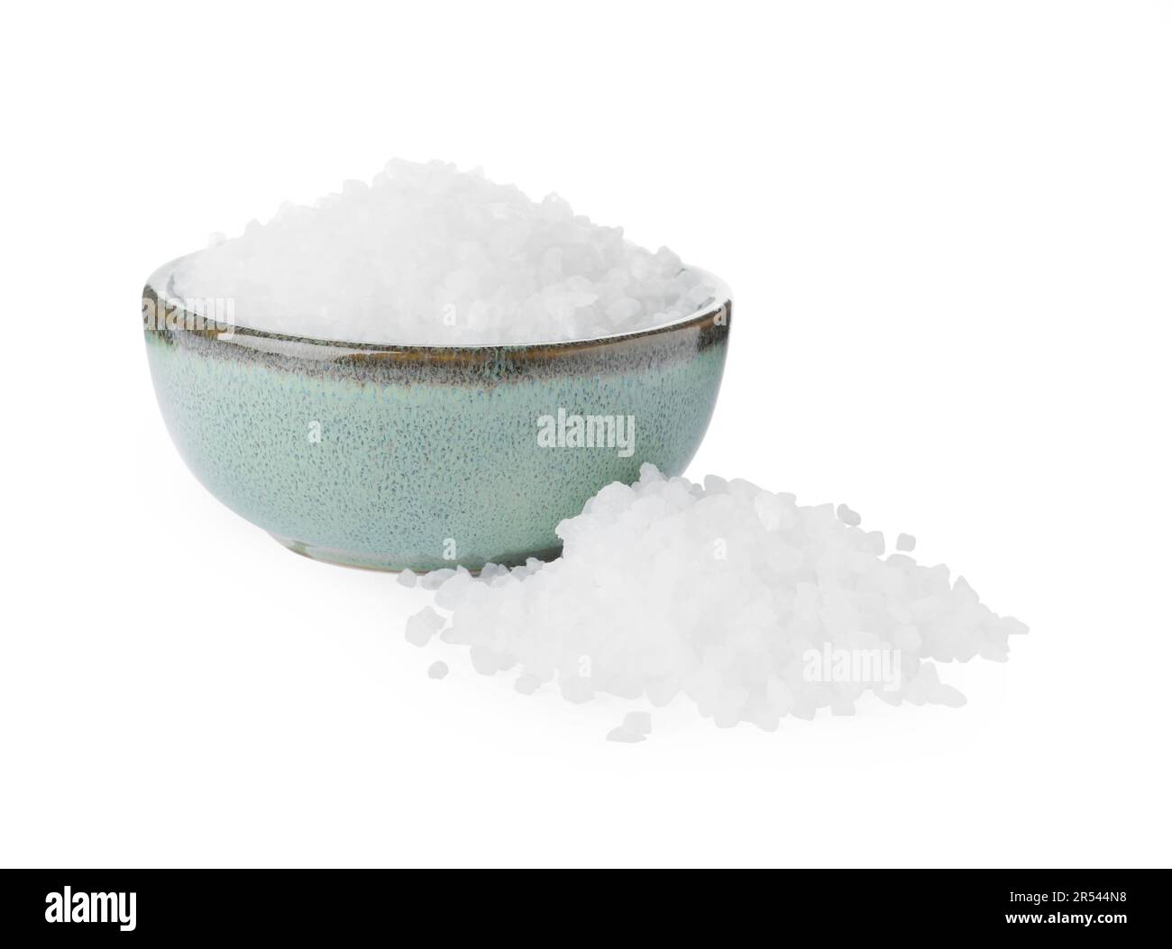 Ceramic bowl and heap of natural sea salt isolated on white Stock Photo ...