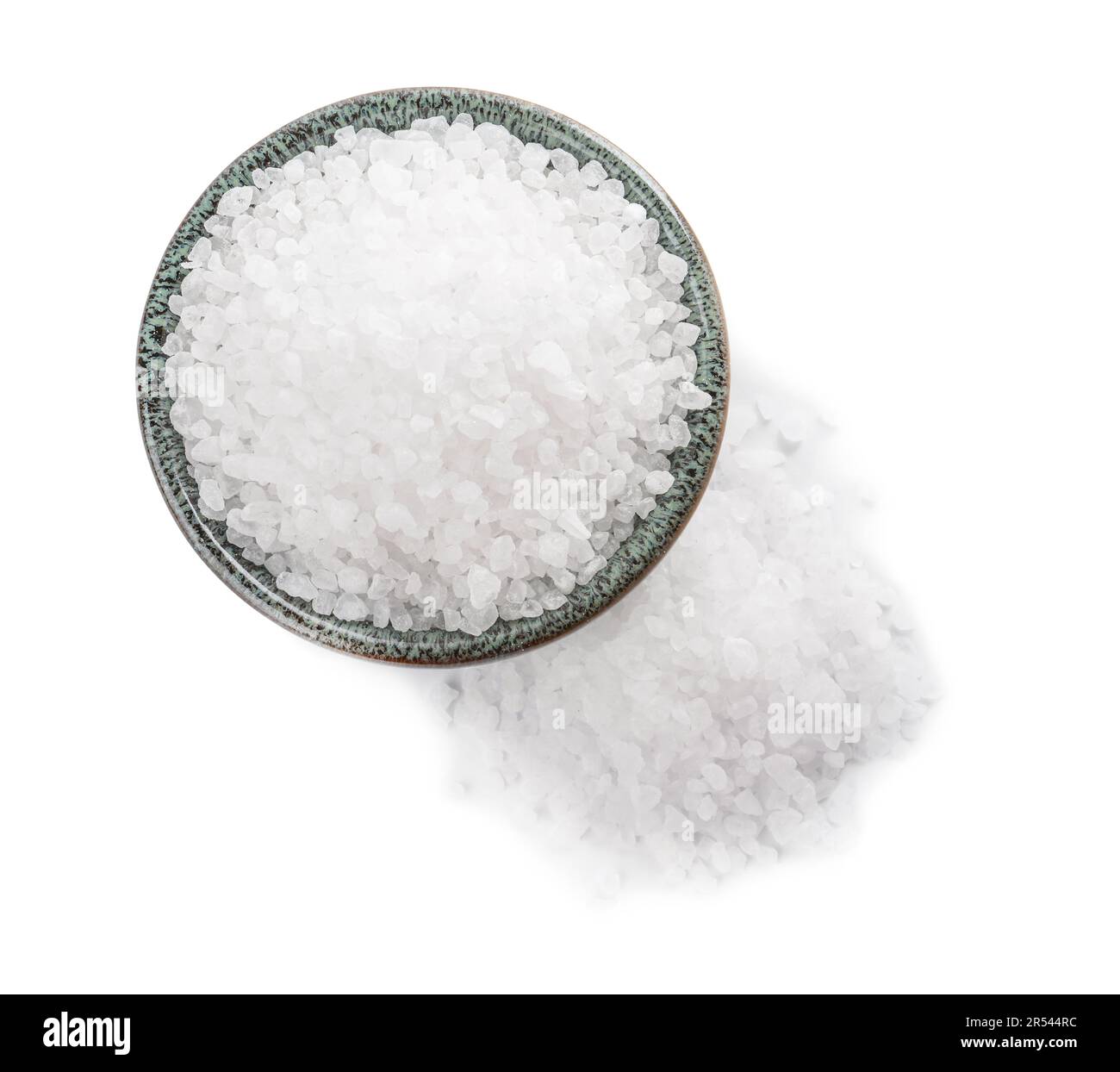 Ceramic bowl and heap of natural sea salt isolated on white, top view ...