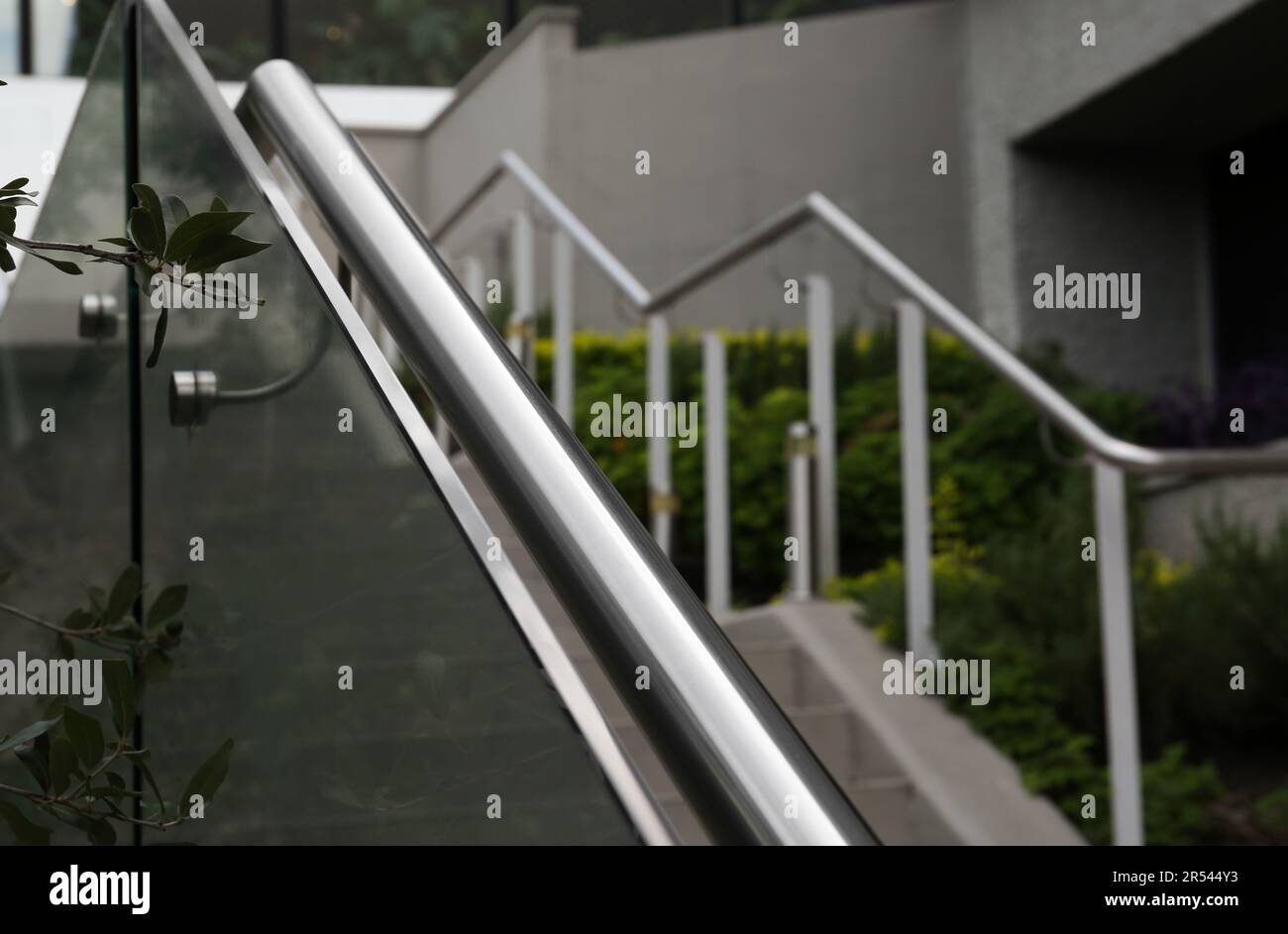 Outdoor staircase with metal handrails on city street, closeup Stock ...
