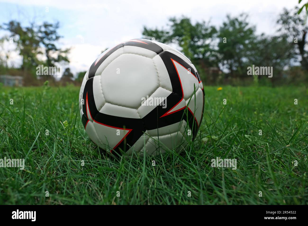 New soccer ball on fresh green grass outdoors Stock Photo - Alamy