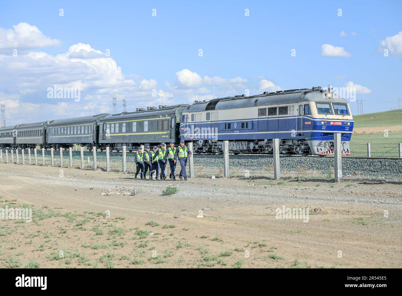 ALTAY, CHINA - MAY 31, 2023 - Road guards patrol a railway line in ...