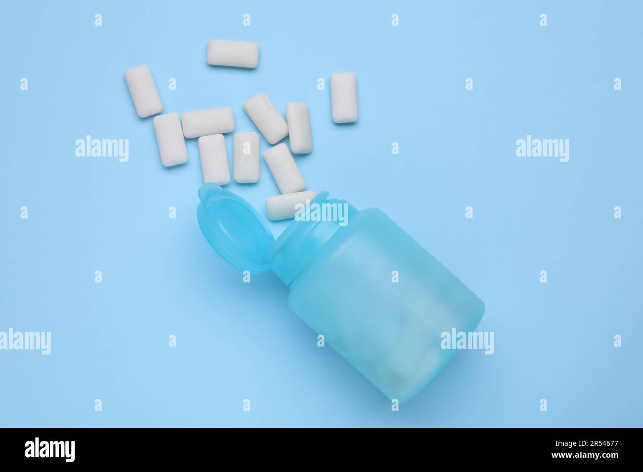 Jar with chewing gums on light blue background, flat lay Stock Photo ...