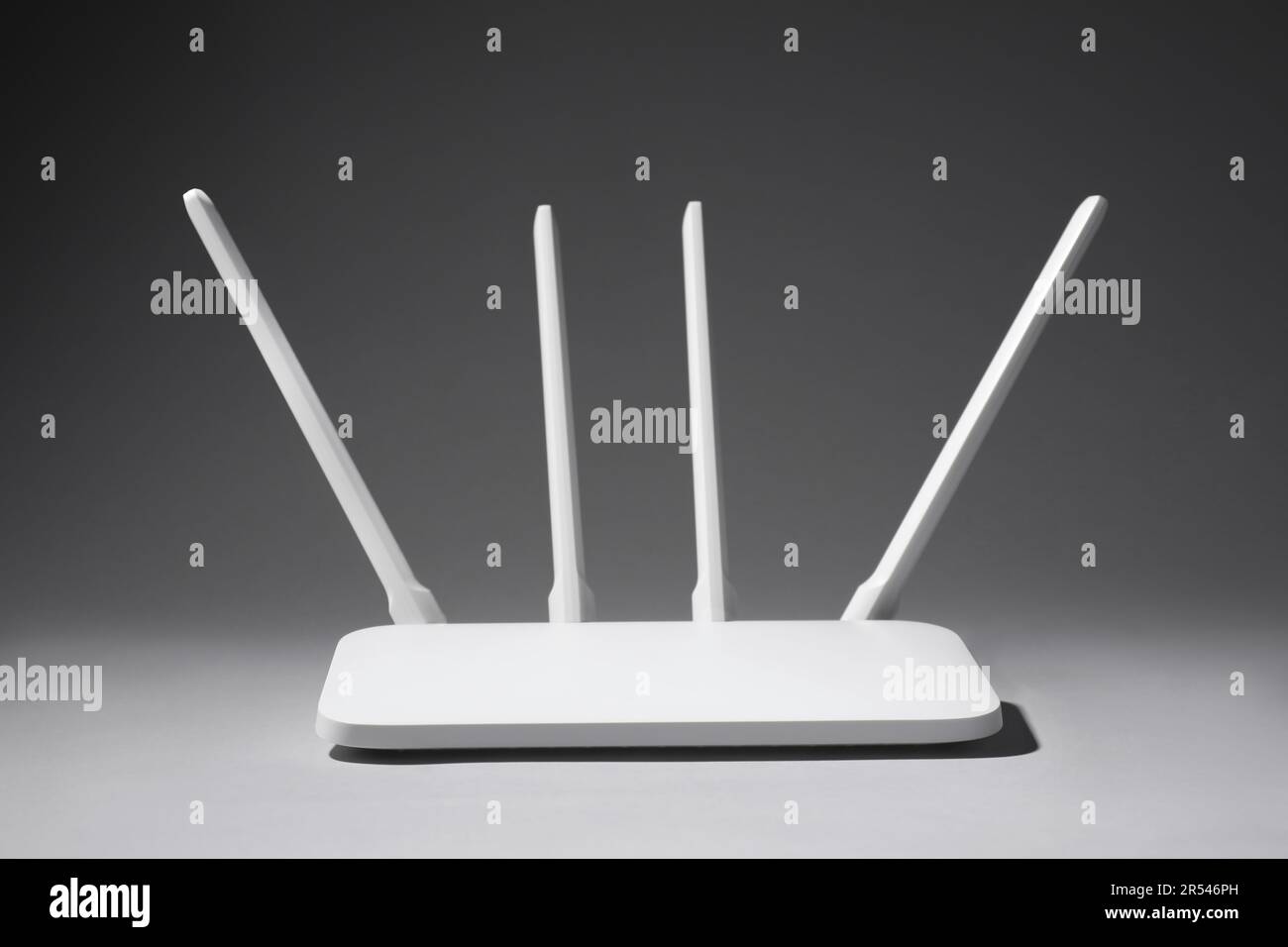 New stylish Wi-Fi router on grey background Stock Photo - Alamy