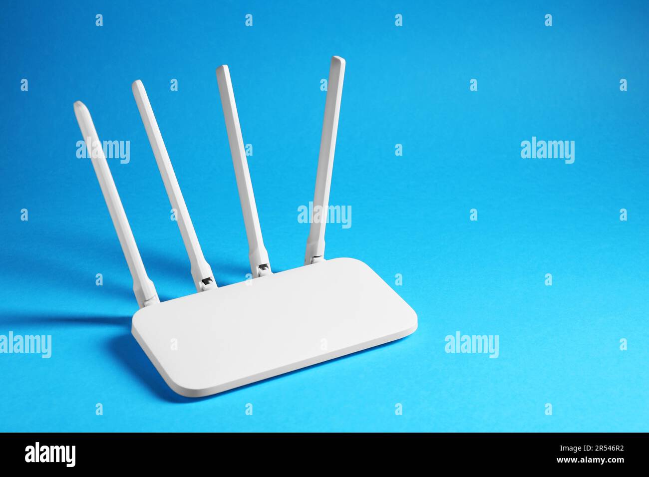 New white Wi-Fi router on blue background, space for text Stock Photo ...