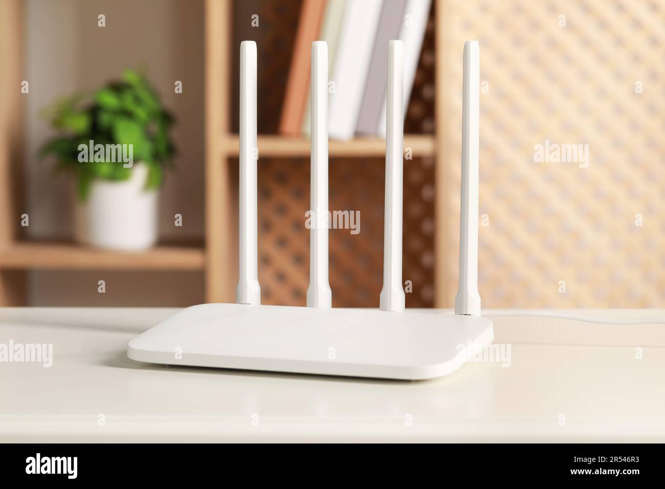 New Wi-Fi router on white table indoors Stock Photo - Alamy