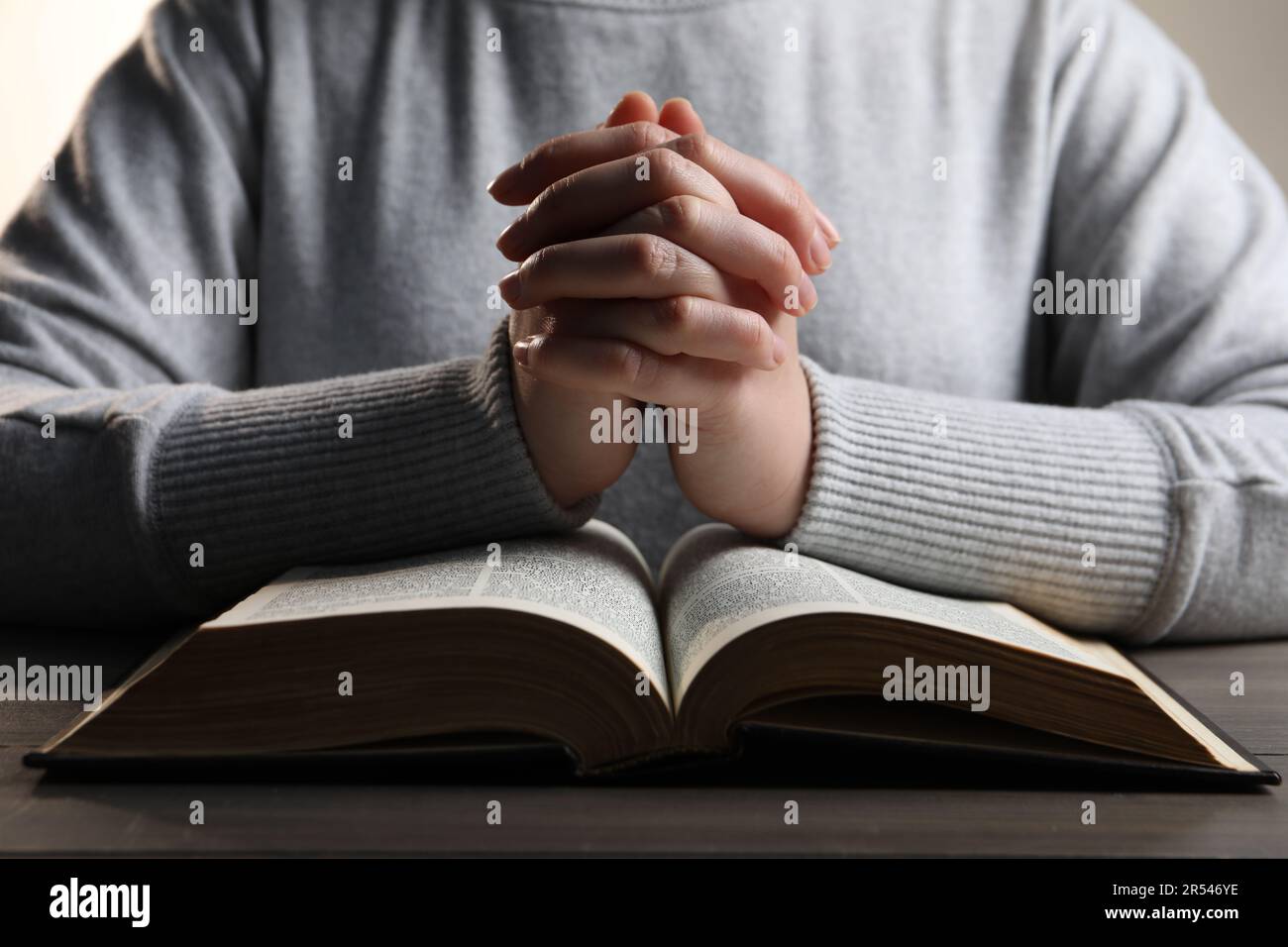 Female holding open bible hi-res stock photography and images - Alamy
