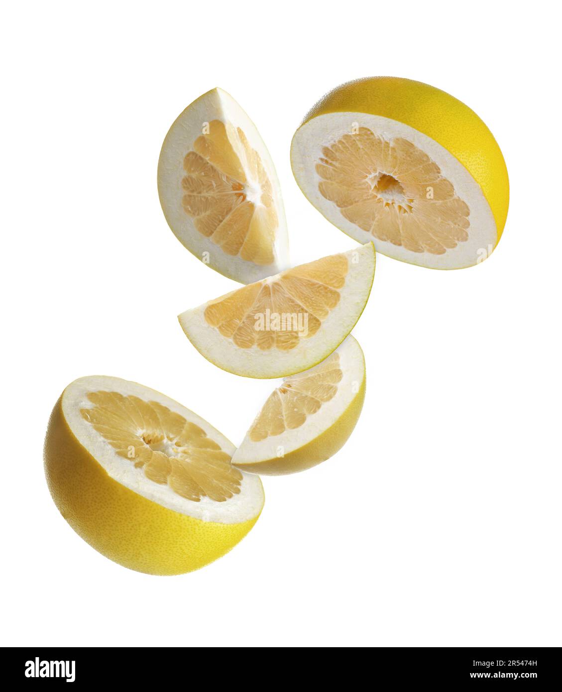 Fresh pomelo fruit falling on white background Stock Photo - Alamy