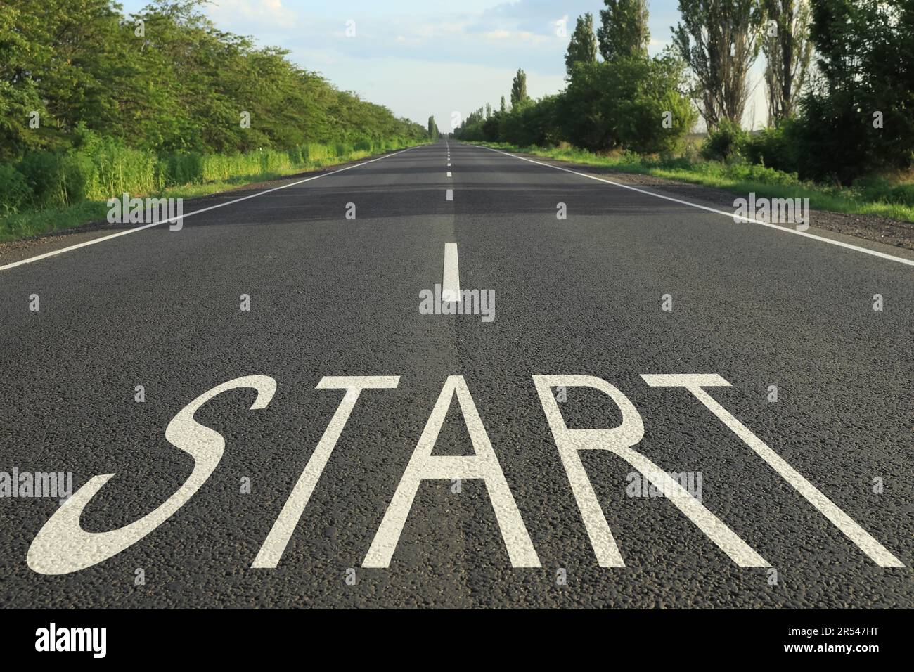New beginnings. Word Start on asphalt road outdoors Stock Photo - Alamy