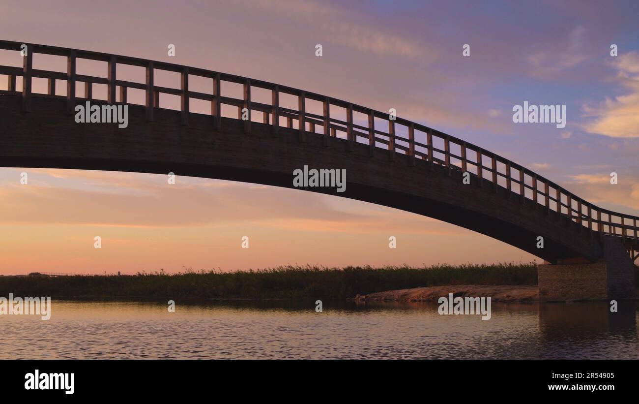 Wooden bridge over the water. Autumn sunset light light in Esmoriz ...
