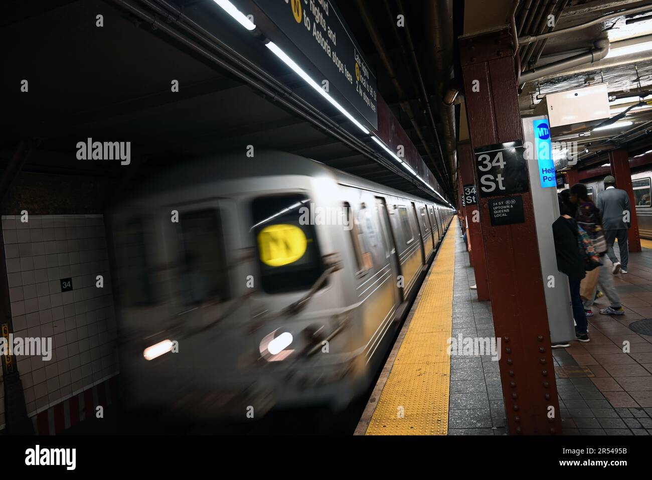 A subway train entering the 34th Street MTA station in New York City Stock Photo - Alamy