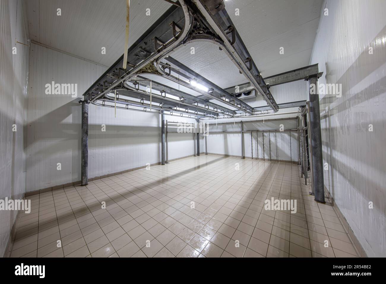 Meat processing machines at meat factory. Cutting meat in ...