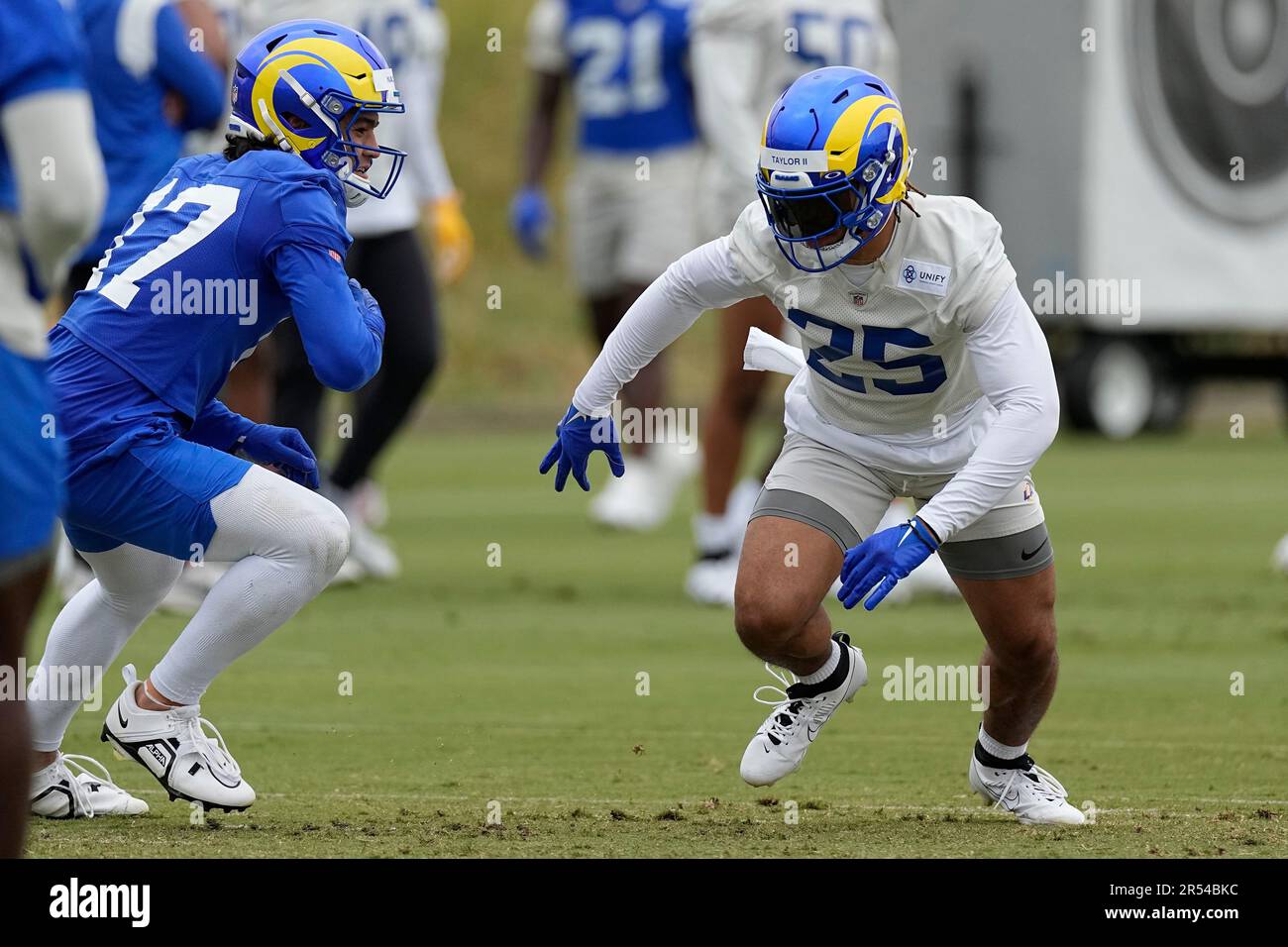 Los Angeles Rams safety Jason Taylor II, right, runs a play against ...