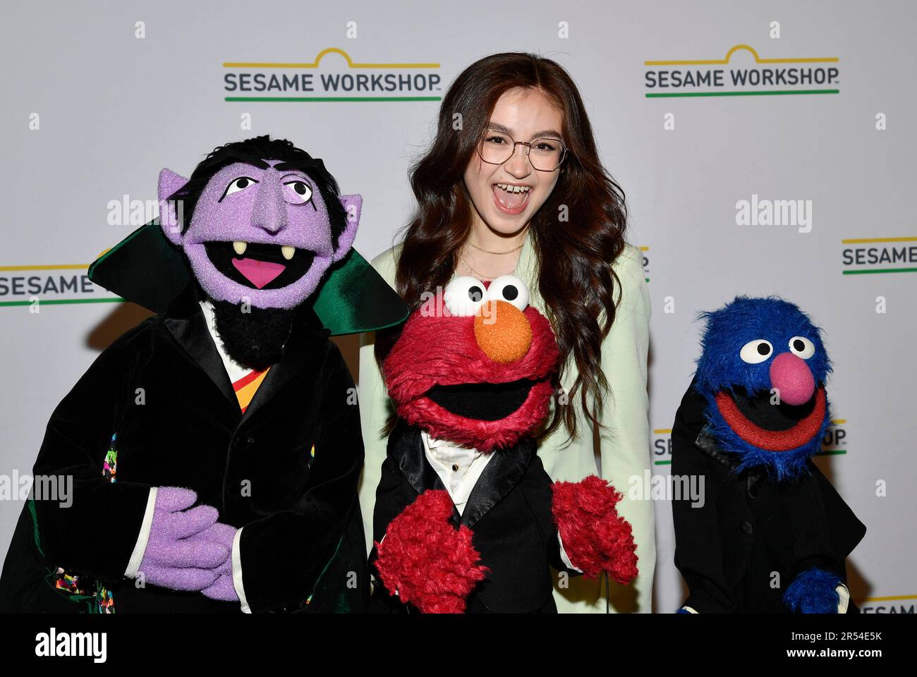Anna Cathcart, center, poses with Count von Count, Elmo and Grover at ...