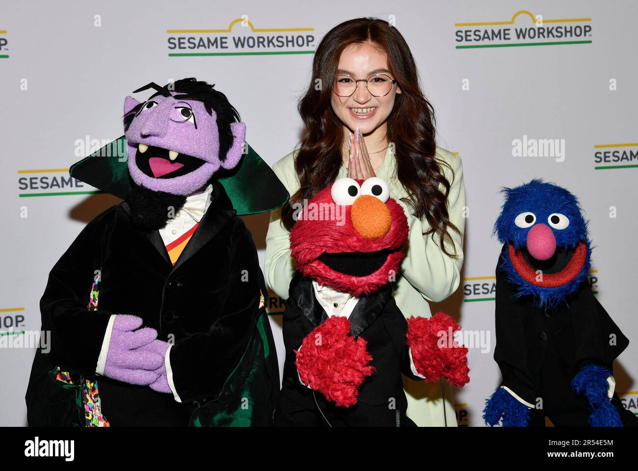 Anna Cathcart, center, poses with Count von Count, Elmo and Grover at ...