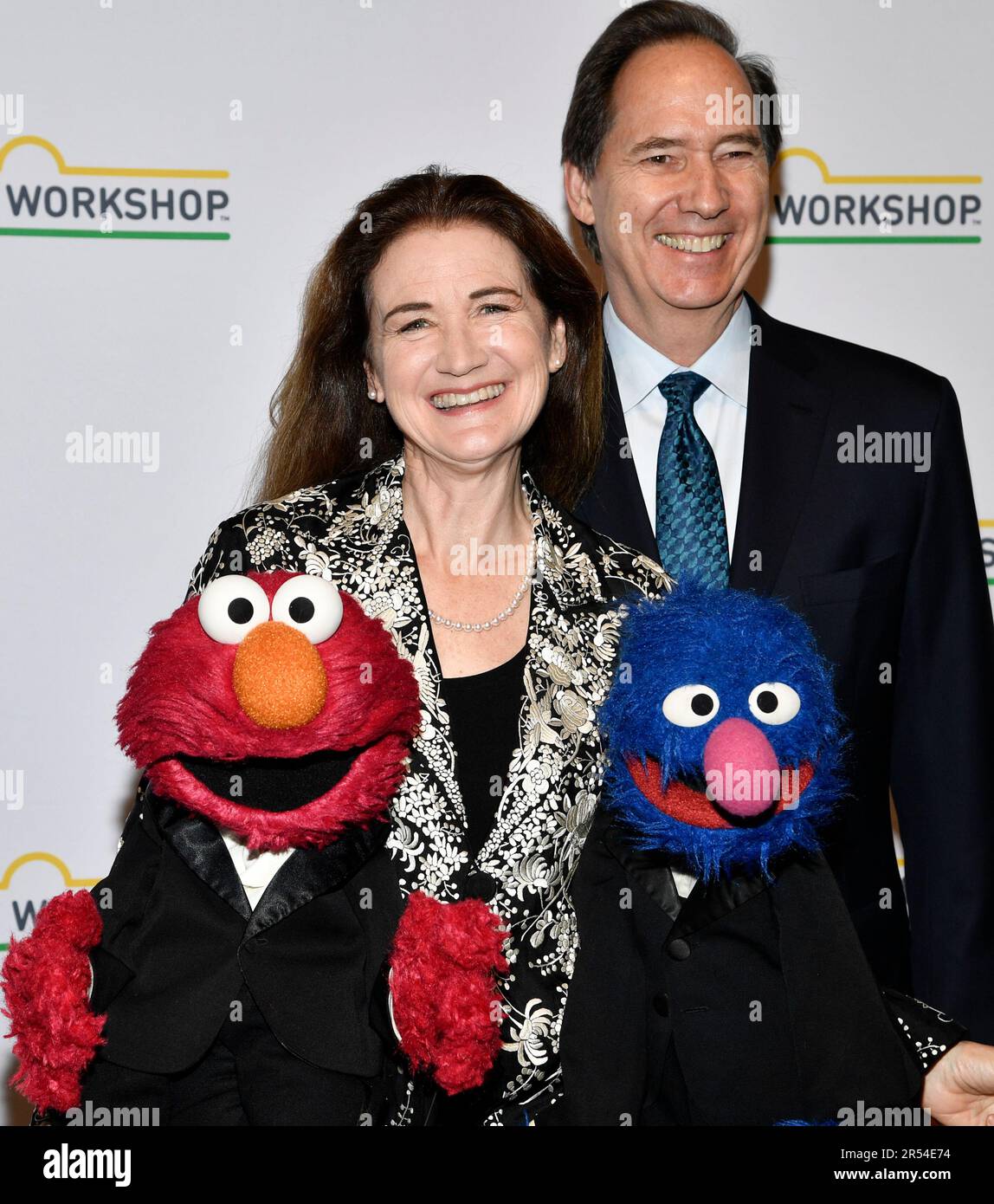 Cheryl Henson, left, and husband Edwin Finn Jr. pose with Sesame Street ...