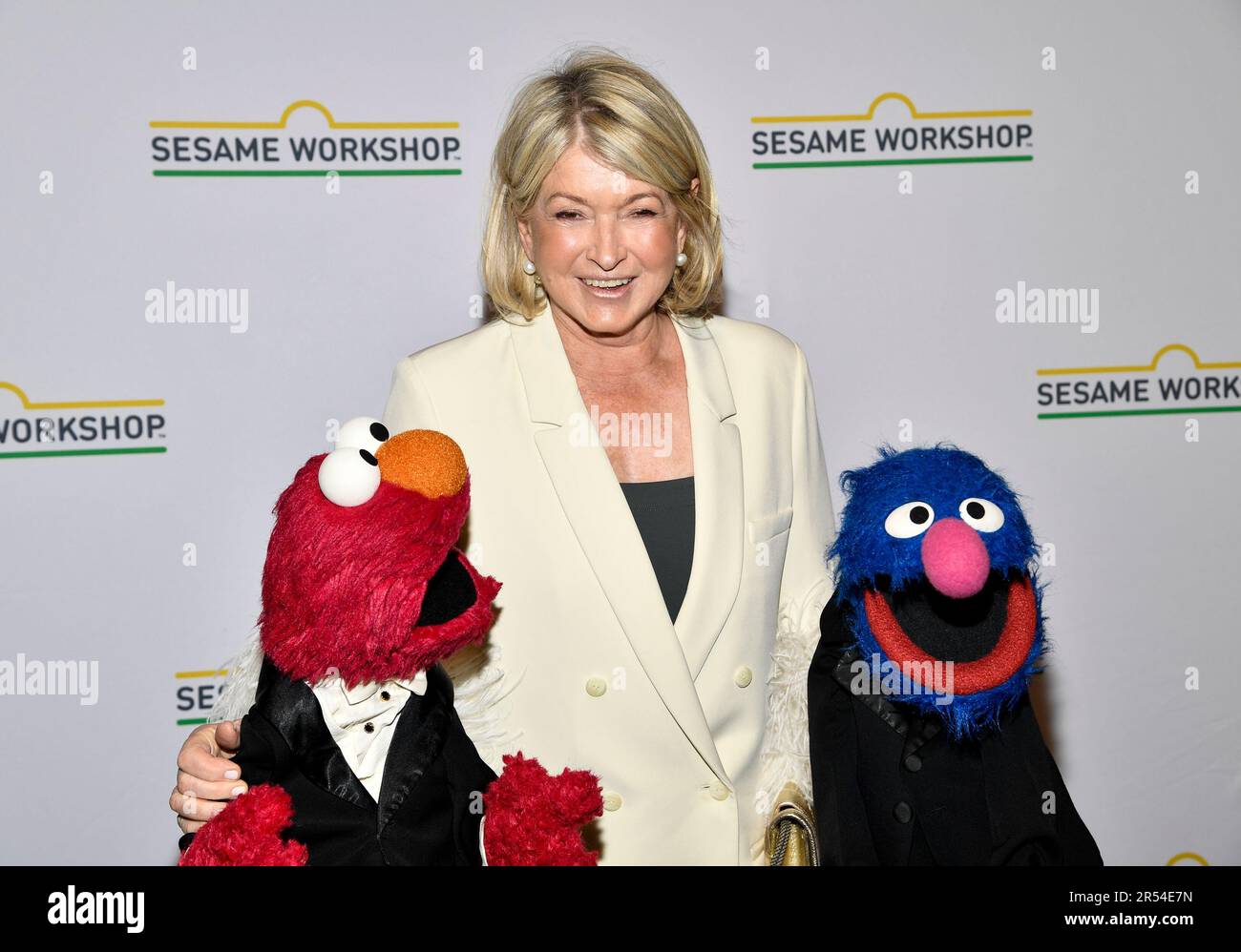 Martha Stewart, center, poses with Elmo, left, and Grover at the Sesame ...