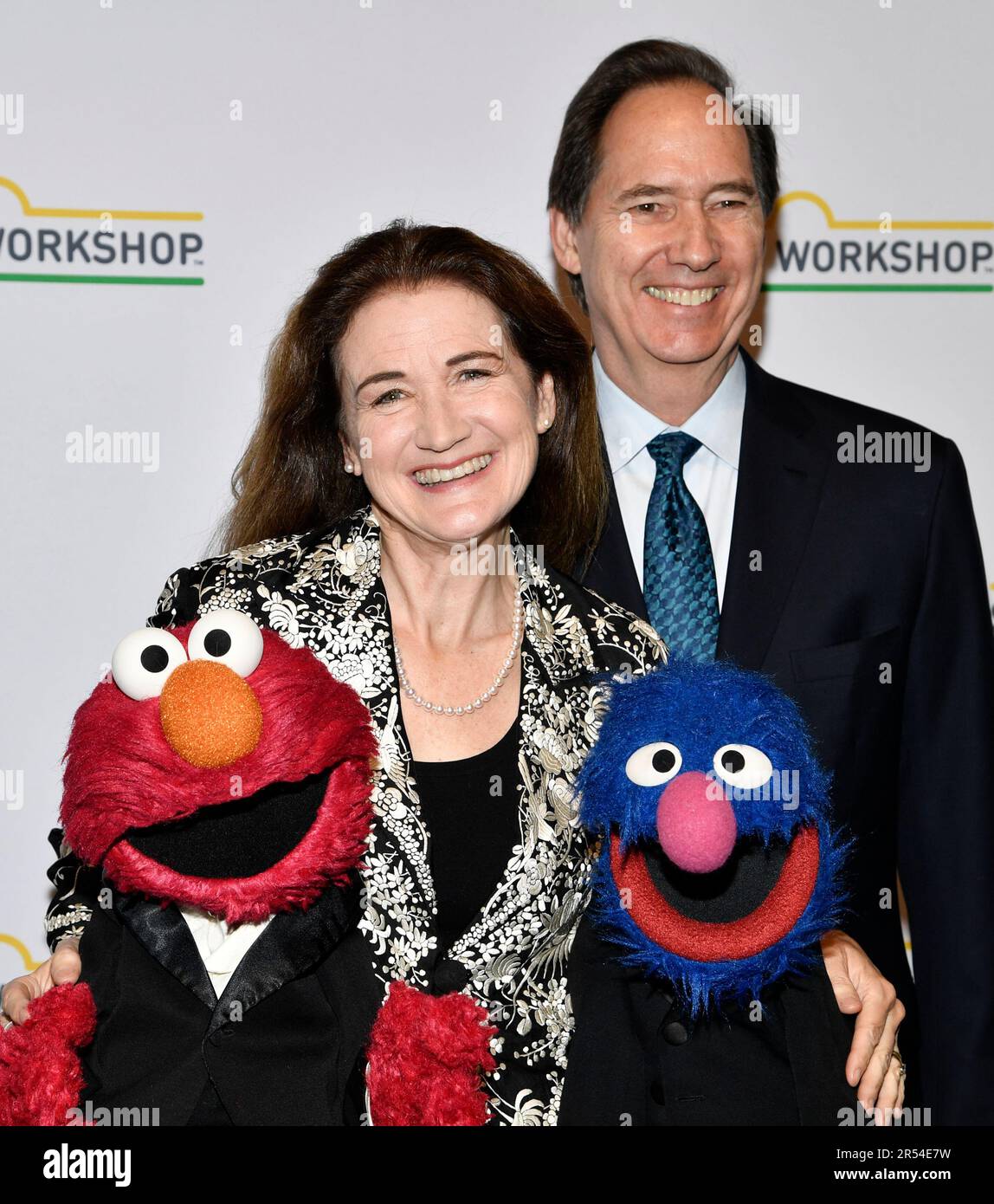 Cheryl Henson, left, and husband Edwin Finn Jr. pose with Sesame Street ...