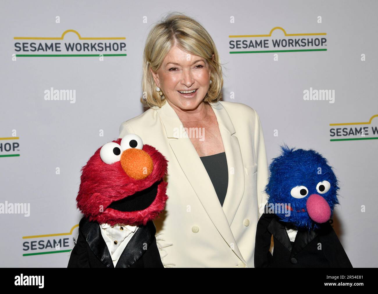Martha Stewart, center, poses with Elmo, left, and Grover at the Sesame Workshop annual benefit ...