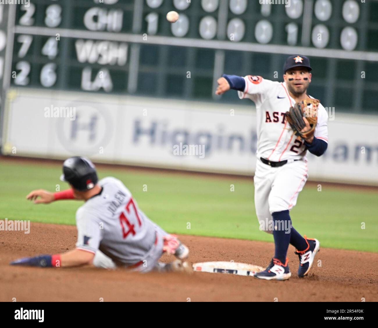 Houston Astros second baseman Jose Altuve (27) turns a double-play in the top of the eight ...