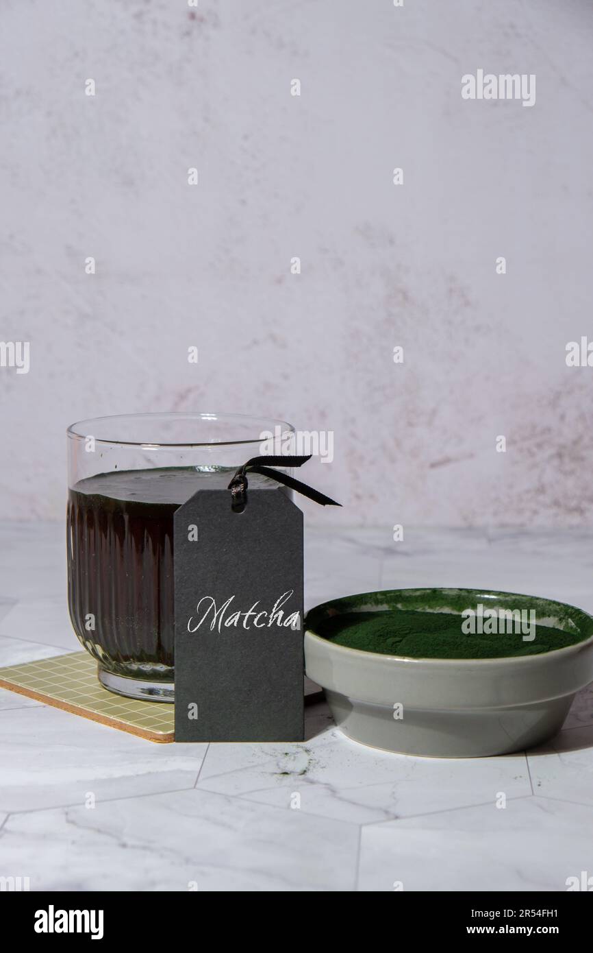 Blue-green algae Chlorella and spirulina powder drink with paper note ...