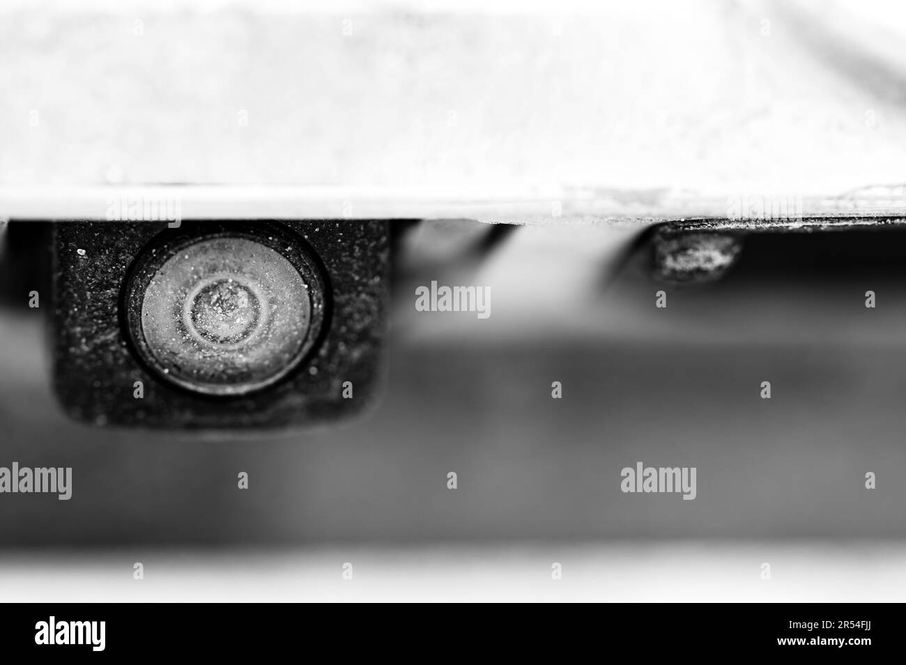 Backup camera on a vehicle obscured with dirt, mud, and dust so that ...