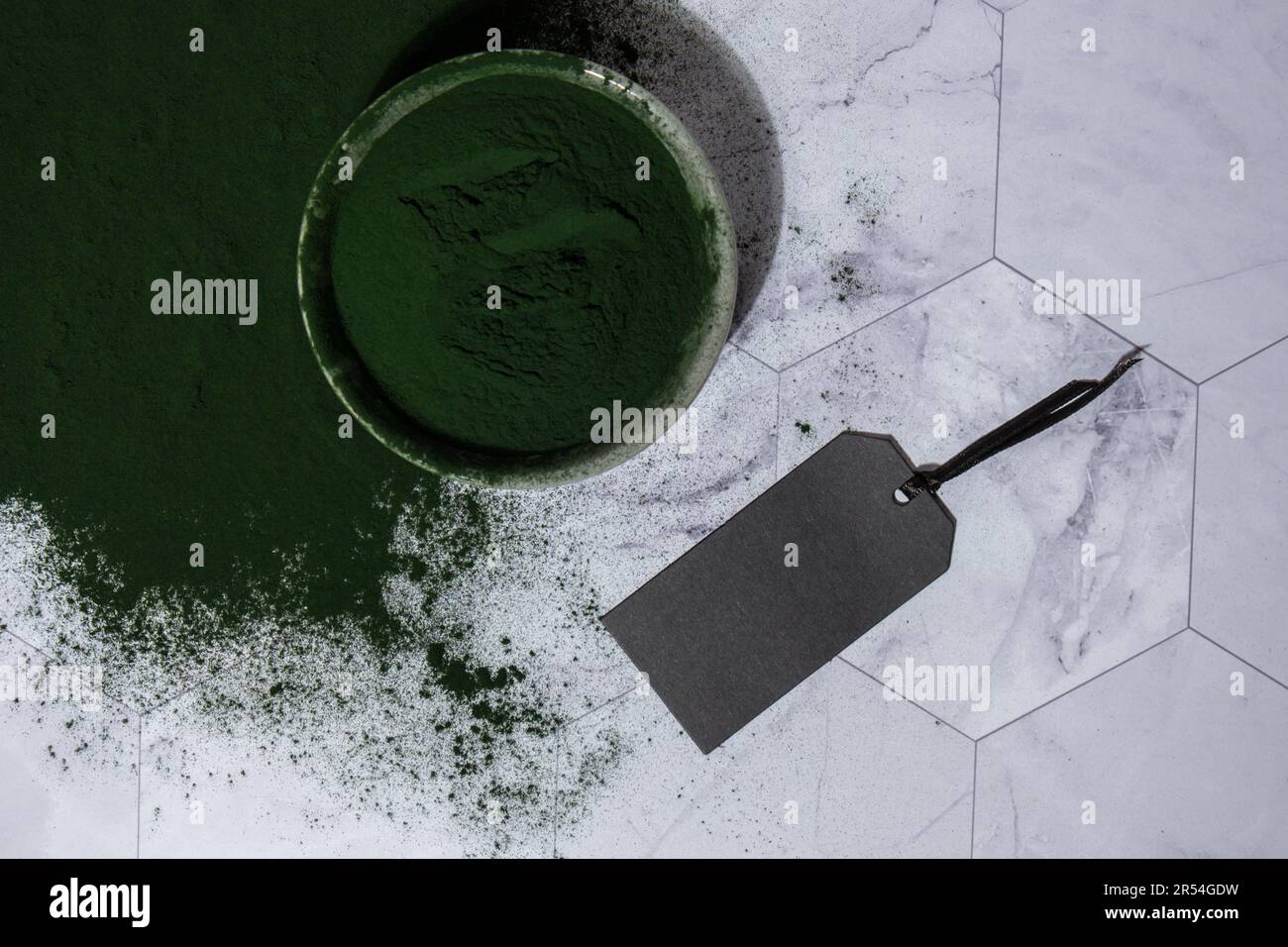 Blue-green algae Chlorella and spirulina powder in bowl with empty ...