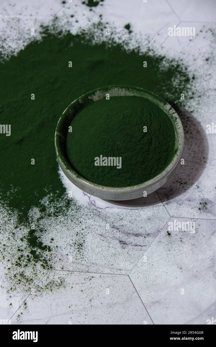 Blue-green algae Chlorella and spirulina powder in bowl. Super powder ...