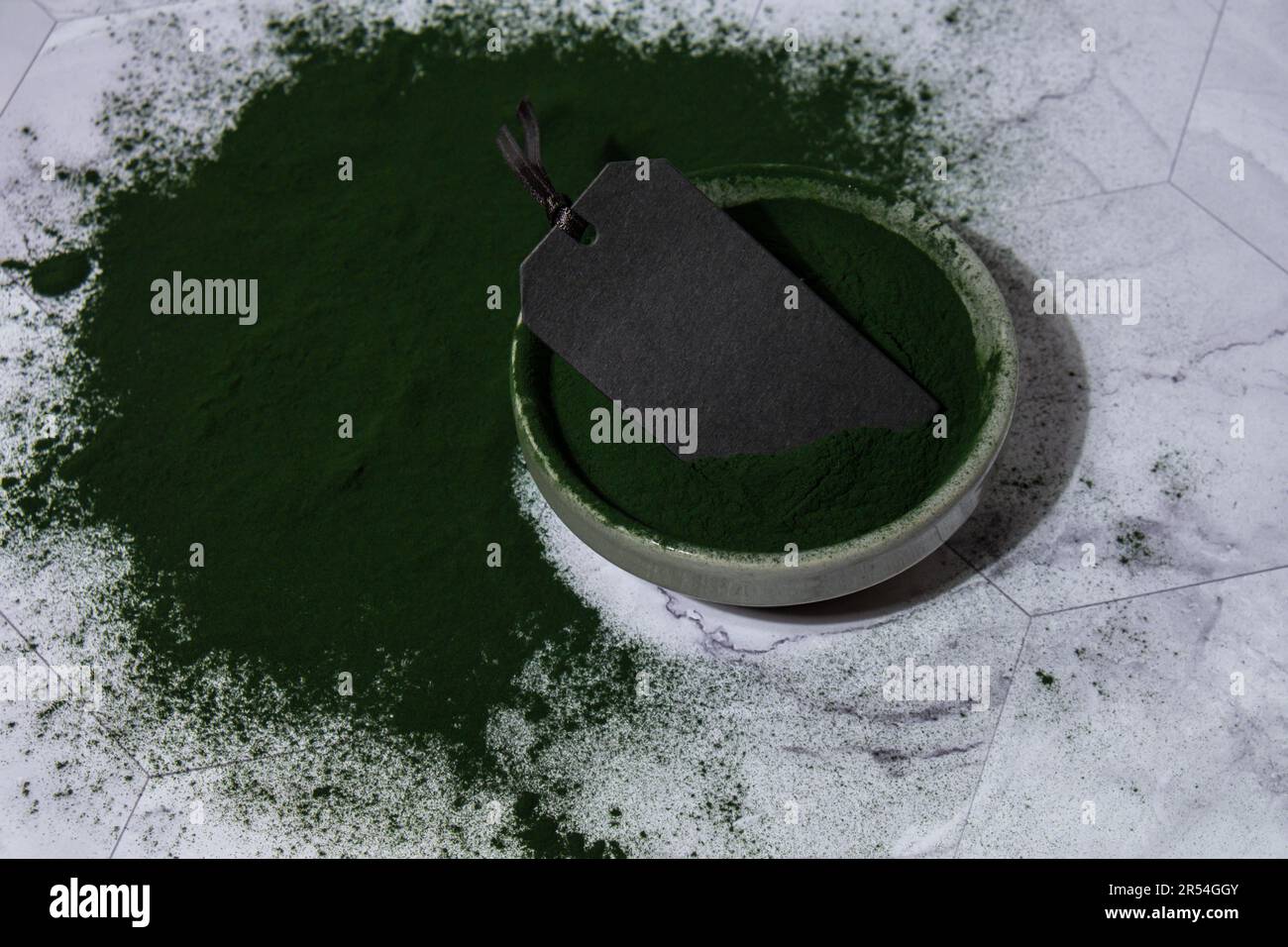 Blue-green algae Chlorella and spirulina powder in bowl with empty ...