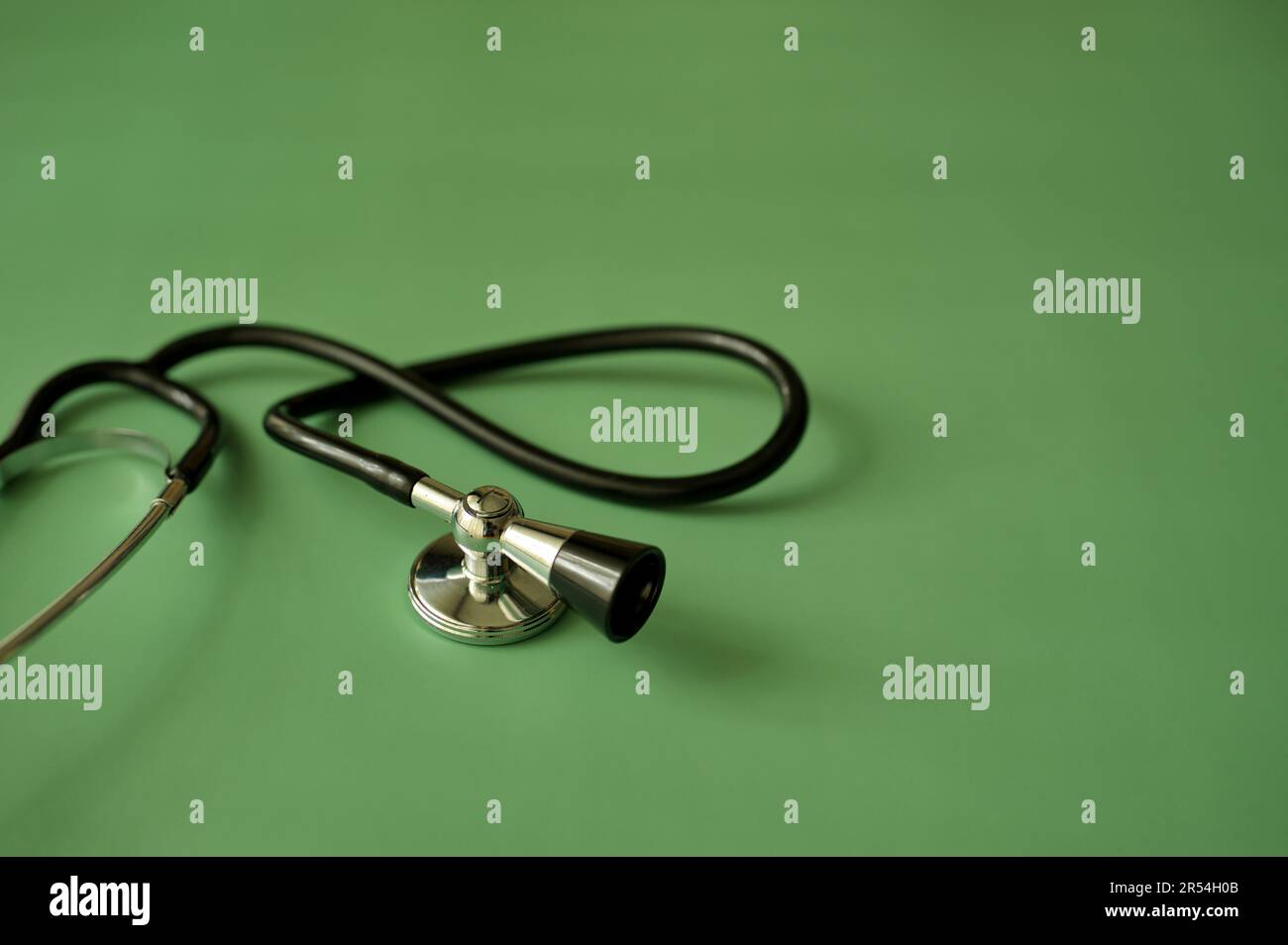 Stethoscope on green background - health check up concept Stock Photo ...