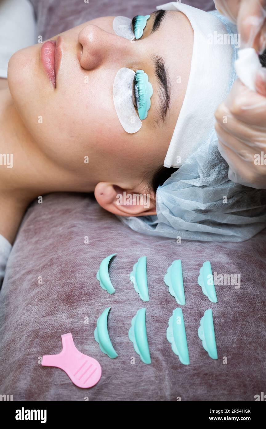 The master removes the composition for lamination from the client's ...