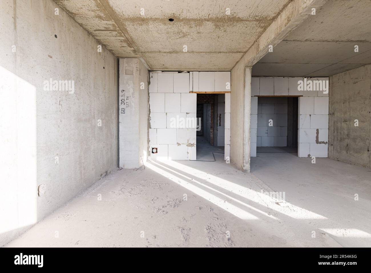 Empty concrete commercial space without finishing with partitions Stock ...