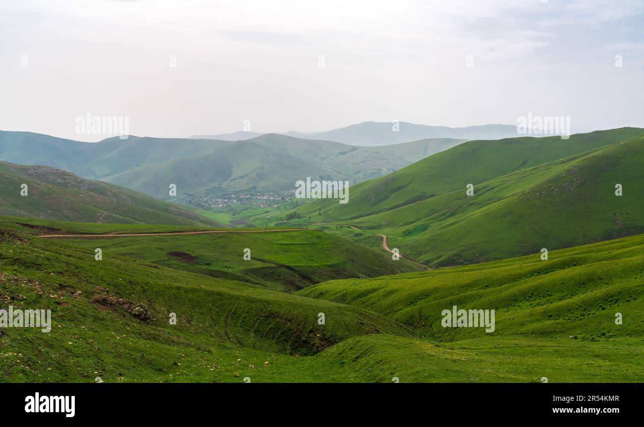 Mountain landscape covered with green grass Stock Photo - Alamy