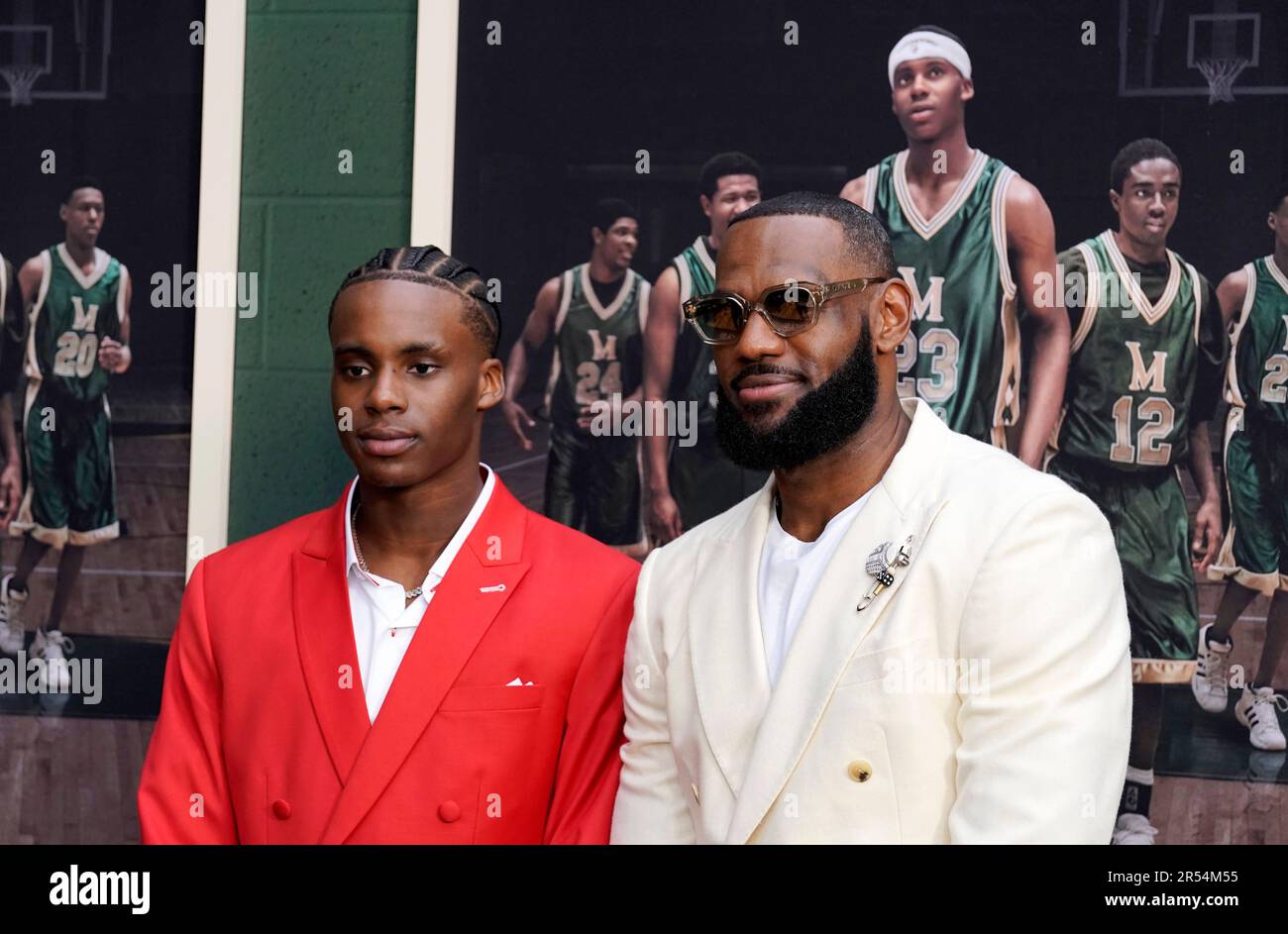 Marquis "Mookie" Cook, left, who portrays LeBron James in ""Shooting Stars," poses with James at ...