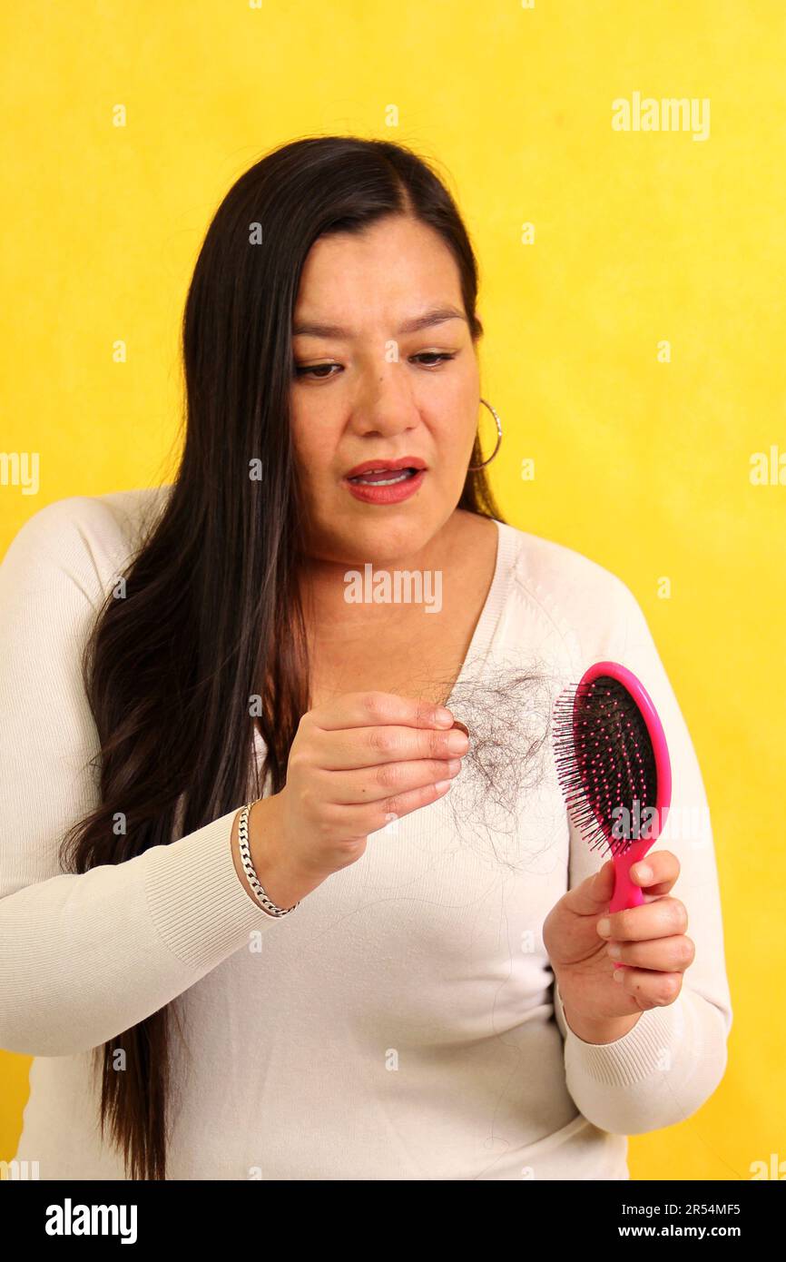 Adult Latina Woman Suffers From Hair Loss When Brushing It A Symptom Of Alopecia Lupus