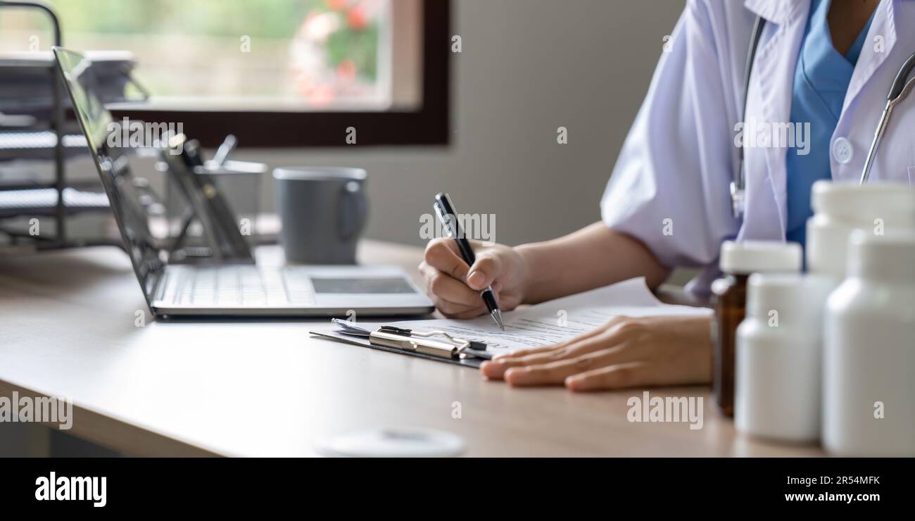 Doctor are recommending medicines to patients after being examined and ...