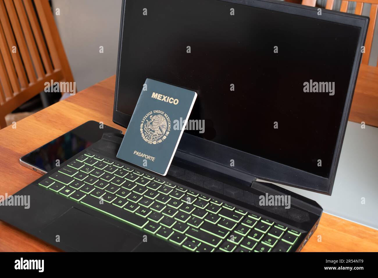 Mexican passport on black laptop computer Stock Photo - Alamy