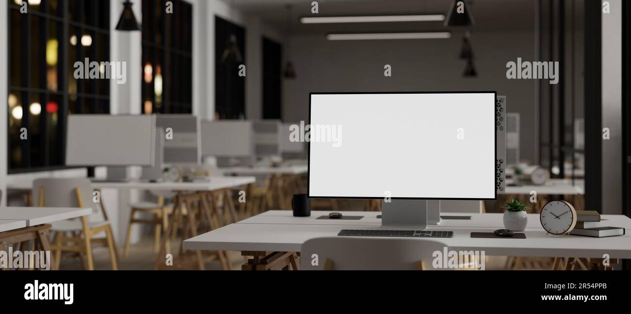 A computer white screen mockup on a white table in a modern office with ...